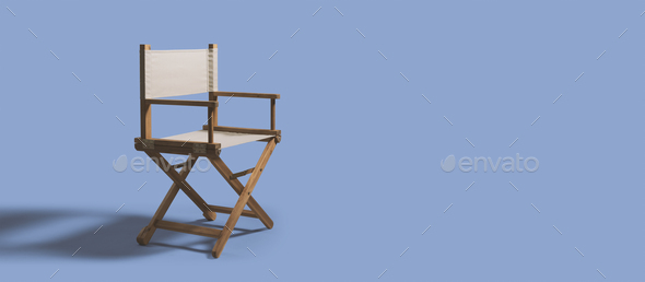 Foldable director's chair: film industry concept Stock Photo by stokkete