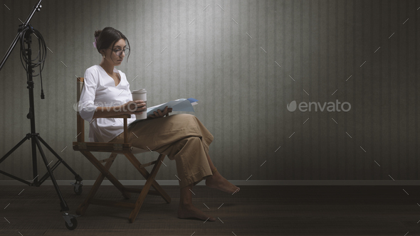 Focused actress reading a script Stock Photo by stokkete | PhotoDune
