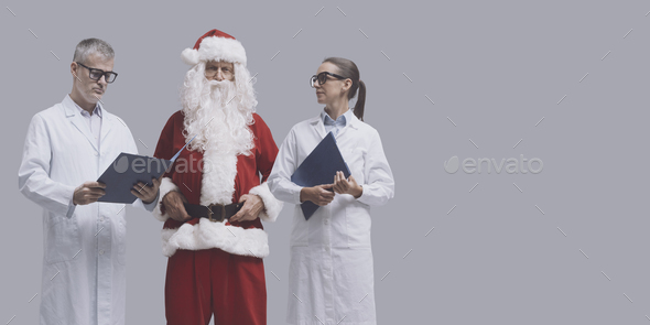 Santa Claus with doctors at the hospital Stock Photo by stokkete ...