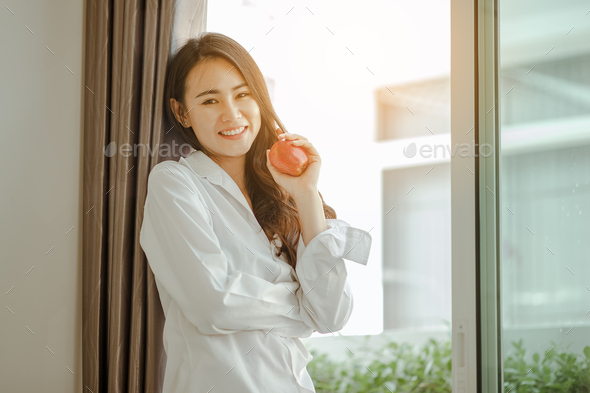 Young woman asia wake up refreshed in the morning and relaxing eat ...