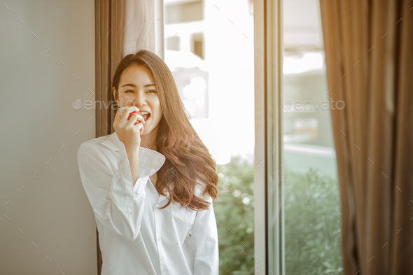 Young woman asia wake up refreshed in the morning and relaxing eat ...