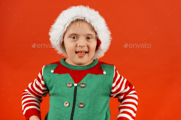 Happy child with Down syndrome having fun and laughing in studio. Stock ...