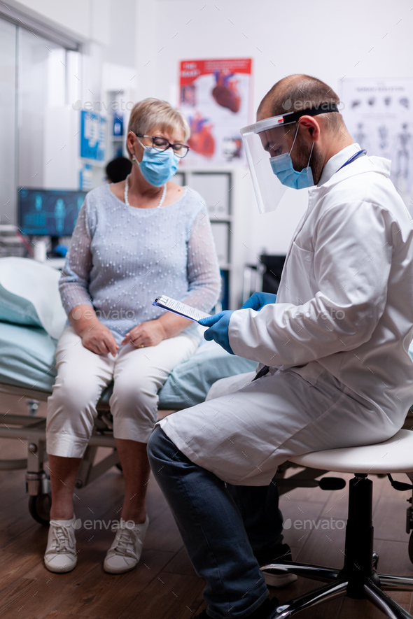 Doctor reading diagnosis Stock Photo by DC_Studio | PhotoDune