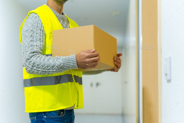 Package delivery worker of an online store, home delivery Stock Photo ...