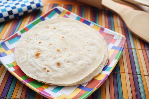 homemade roti chapati on table . Stock Photo by towfiqu98 | PhotoDune