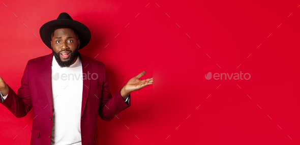 Image of confused Black man asking question, spread hands sideways and ...