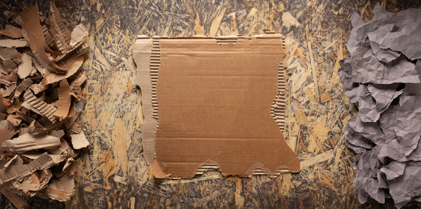 Cardboard torn edge and brown ripped paper on chipboard plywood ...