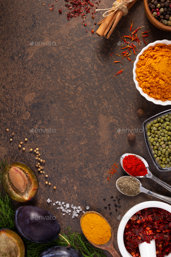 Variety of spices and herbs at table background. Cooking concept and ...