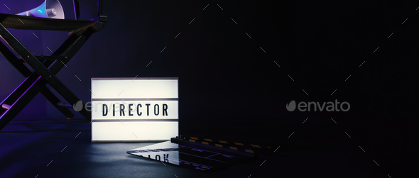 Director chair with cinema lightbox sign Director text on it and ...
