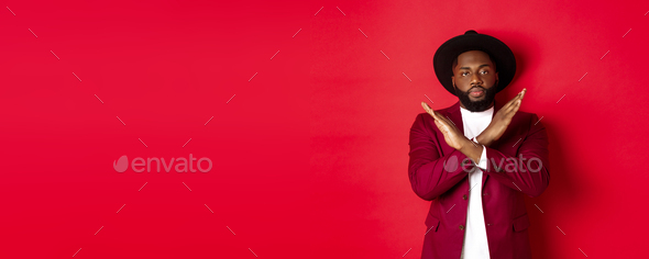 Image of serious Black man strongly disagree, showing cross sign to ...