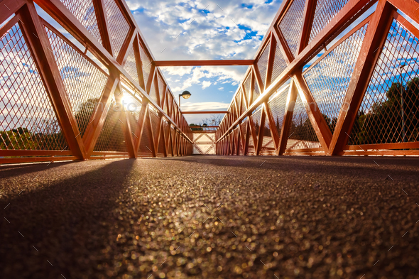 A metallic walkway saves the pedestrian crossing over a highway ...