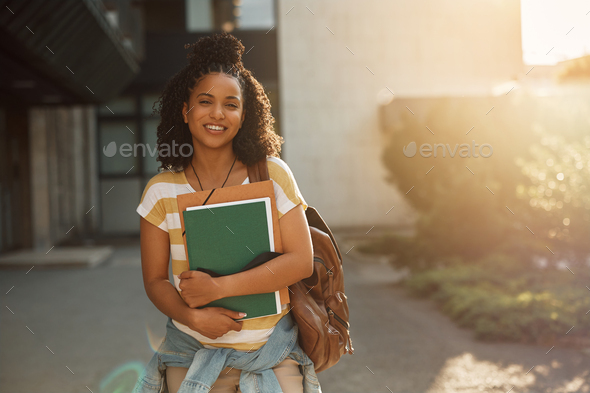 Portrait of black female student at campus looking at camera. Stock ...