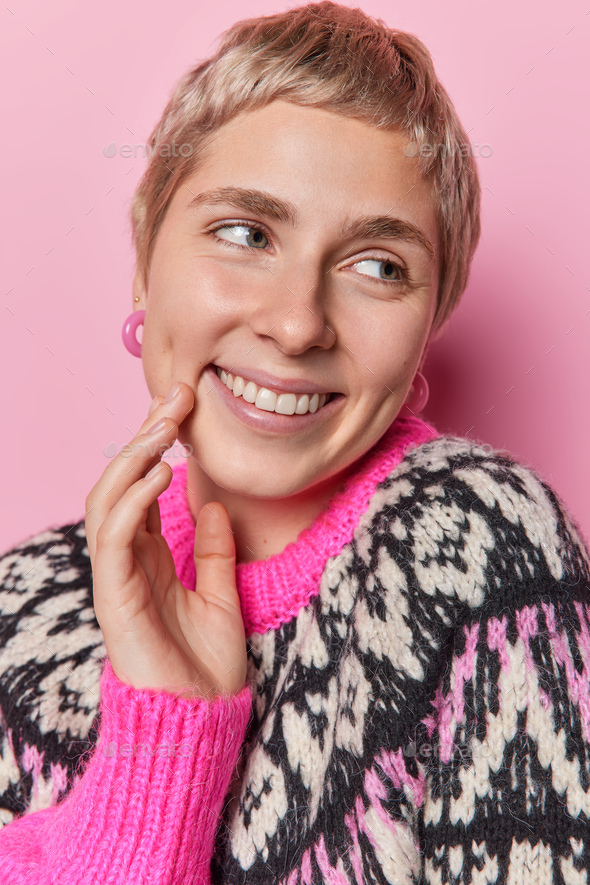 Happy blonde woman expresses authentic positive emotions smiles broadly ...