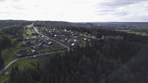 Top view of suburban areas with cottages in forest. Clip. Quiet and ...