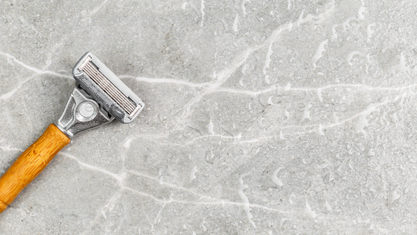 Shaving Razor with wooden handle on a grey marble Stock Photo by Portoprens