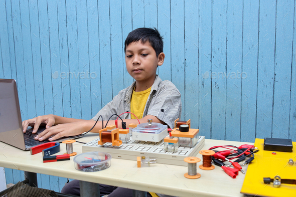 Stem Education. Smart boy learning about electrical Stock Photo by ...