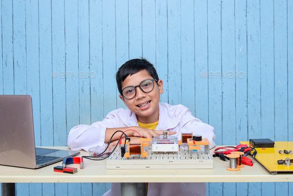 Stem Education. Smart boy learning Stock Photo by Garakta-Studio