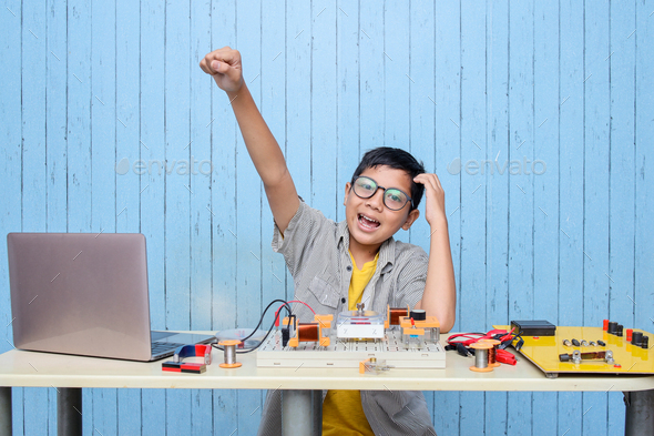 Stem Education. Smart boy learning about electrical Stock Photo by ...