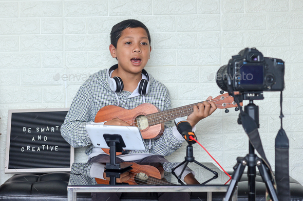 Asian boy young youtuber vlogger influencer Stock Photo by Garakta-Studio