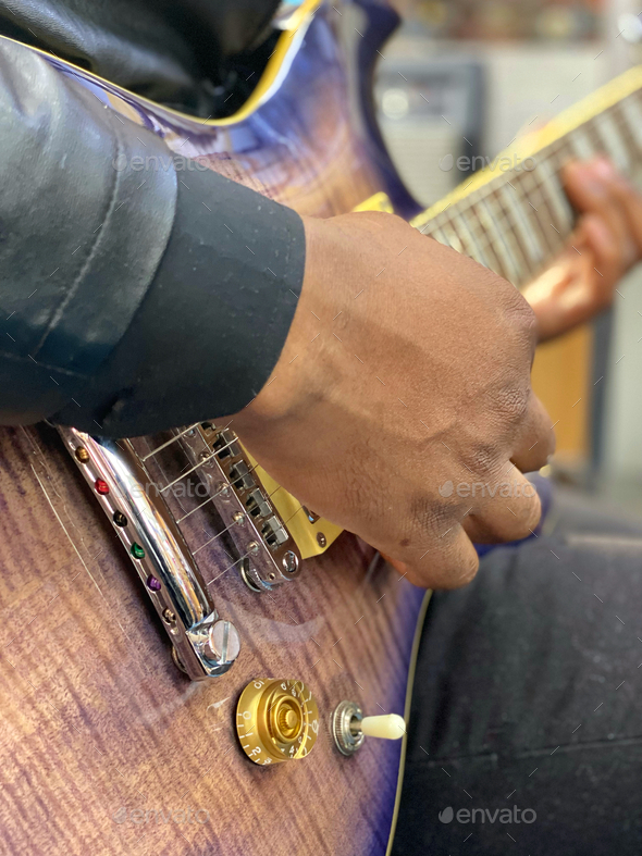 Diverse gen z black male electric guitarist musician plays guitar Stock ...