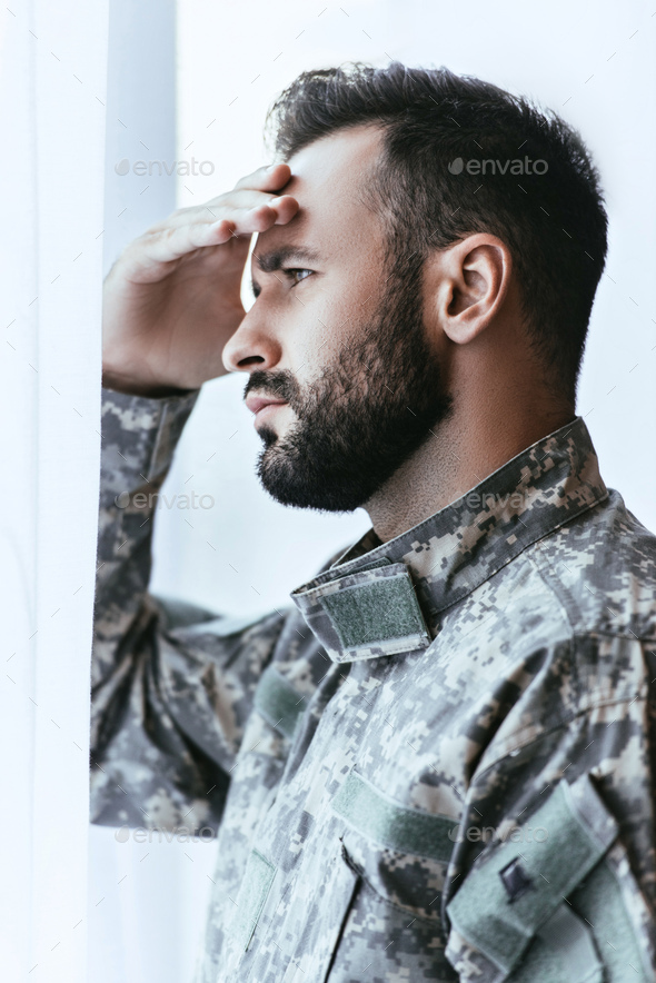 depressed army man in military uniform with post-traumatic stress ...