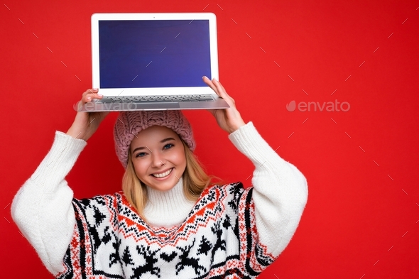 Close-up portrait of Beautiful young woman holding computer laptop with ...