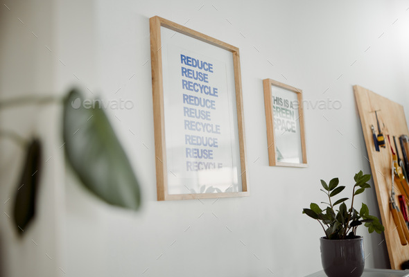 Reduce, reuse and recycle poster hanging in an office as a mantra to ...