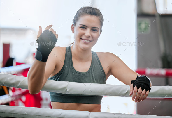 Active, fit and young female boxer ready for a boxing exercise, workout ...