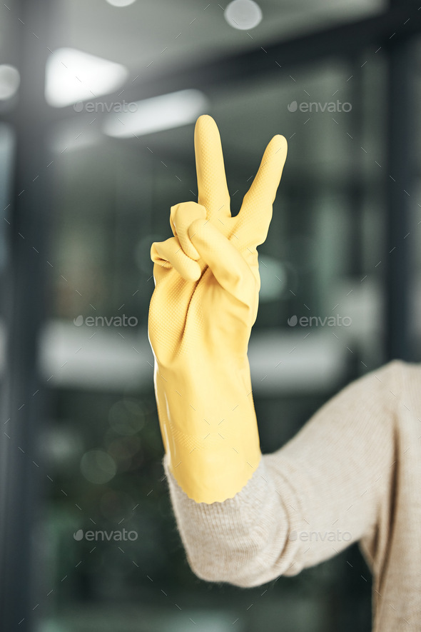 Peace sign, carefree, and hand gesture while cleaning, doing chores and ...