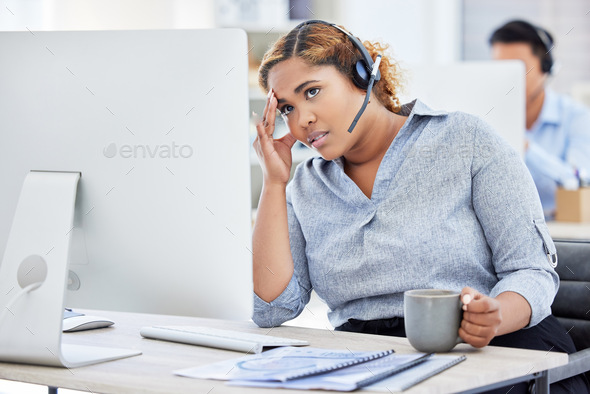 Annoyed, frustrated and stressed call center agent suffering from a ...