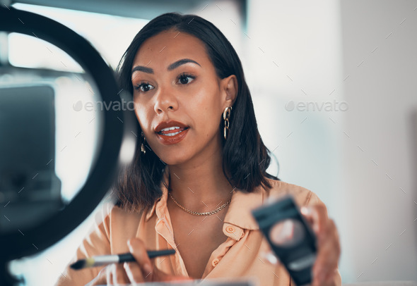 Beauty, vlogger and influencer doing makeup tutorial with digital tech ...