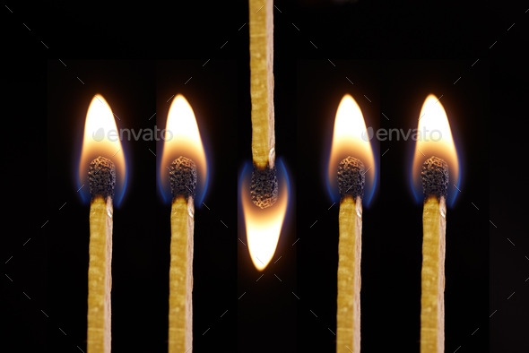 Fire and flame burning on matches sticks as light in the dark against ...