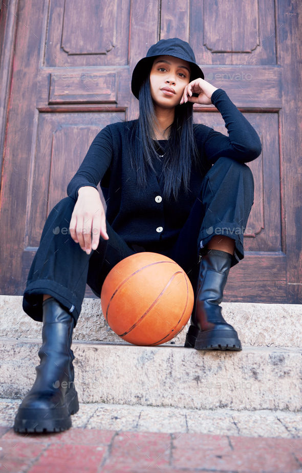 Basketball, fashion and model influencer of a woman posing on steps in ...