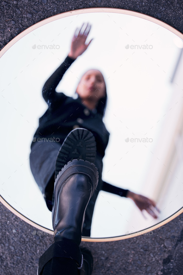 Mirror, reflection and self of a woman standing on a blur vision of ...