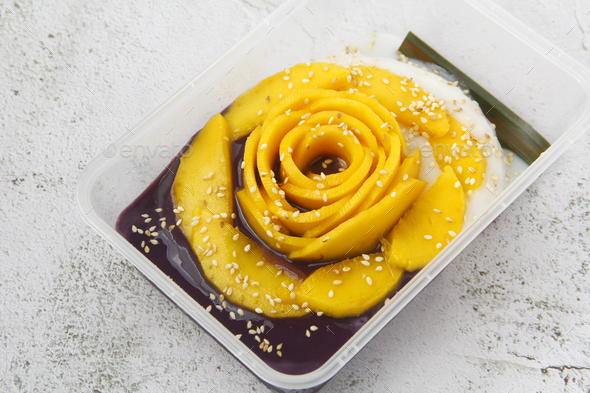 Freshly made Thai food called Thai Sticky Mango Ube Rice Stock Photo by ...