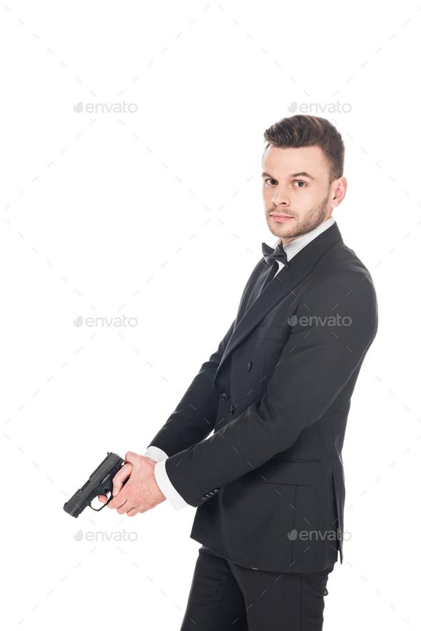 handsome killer in black suit holding gun, isolated on white Stock ...