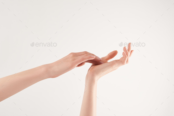 Partial view of well-cared female hands on white background Stock Photo ...