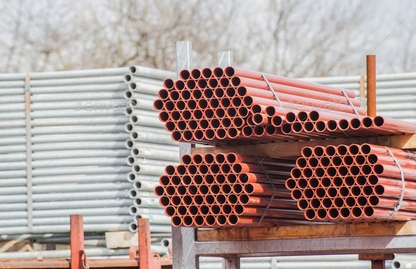 Stack of steel tubes in stock. Stock Photo by scalatore1959 | PhotoDune