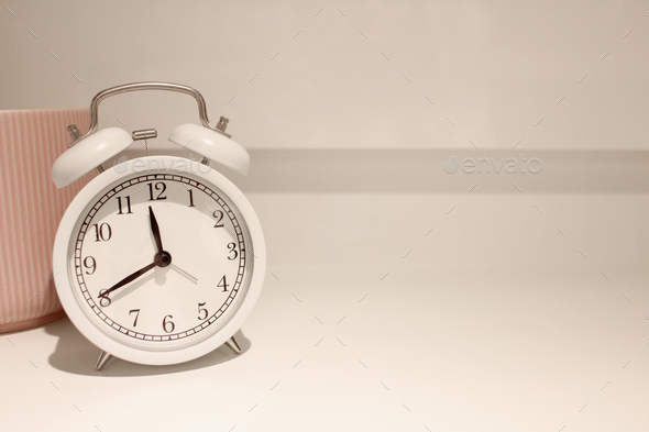 Vintage style alarm clock in neutral tones workspace Stock Photo by ...