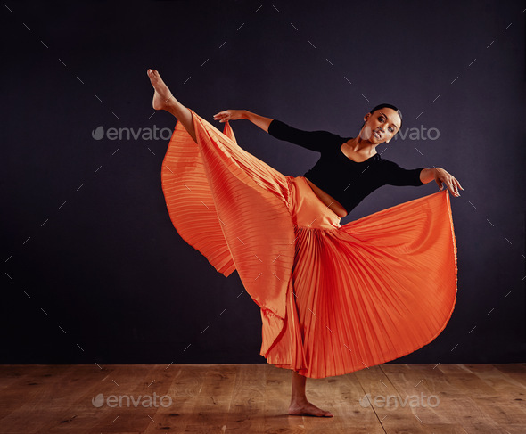 Free form dancing. Female contemporary dancer in a dramatic pose ...