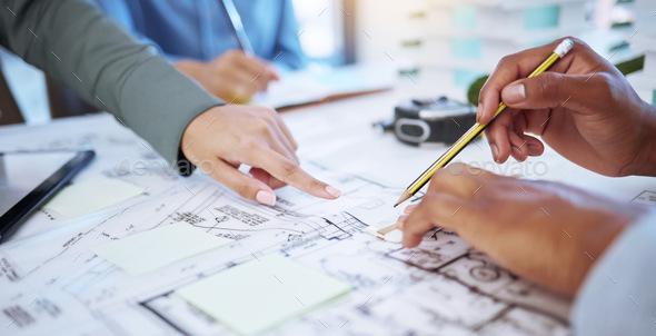 Architect, planning or blueprint with a designer and engineer working ...