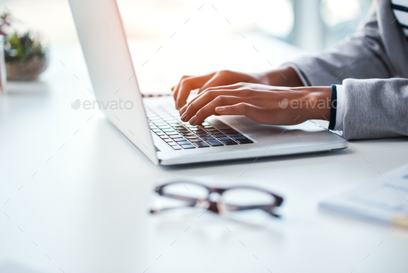 Typing her way to a productive work day Stock Photo by ...
