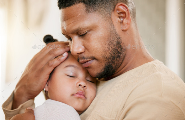 Father embracing his daughter, hugging and bonding while being ...