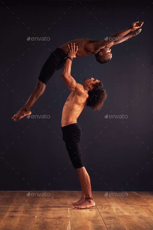 Two male contemporary dancers performing a dramatic pose in front of a ...