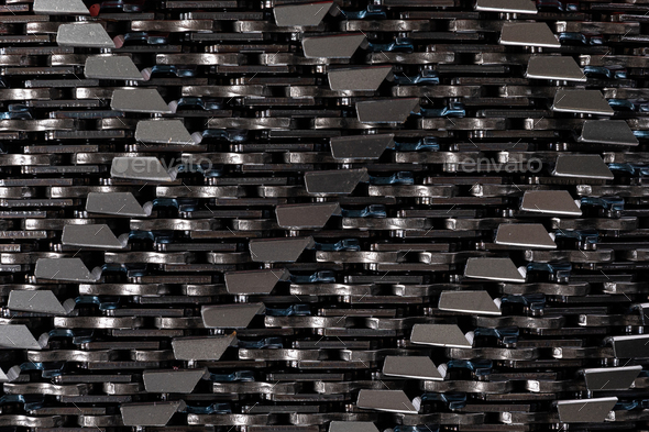 Close-up photo of grey metal saw chain. Background of sawchains Stock ...