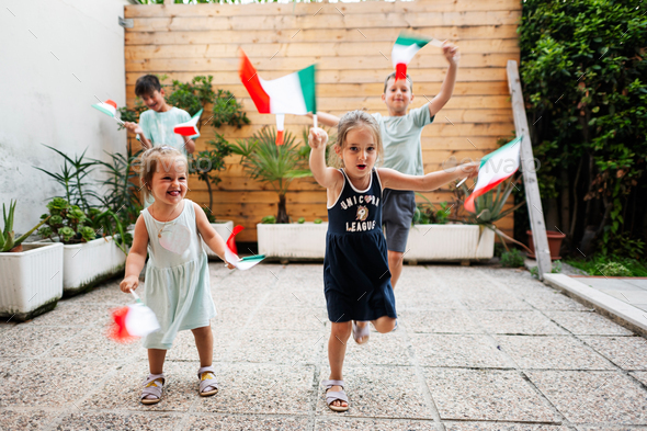 Happy four kids with italian flags celebrating Republic Day of Italy ...