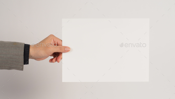The male hand is holding the A4 paper board on white background. Stock ...