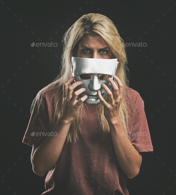 Sad portrait and woman with bipolar mask to hide depression struggle ...