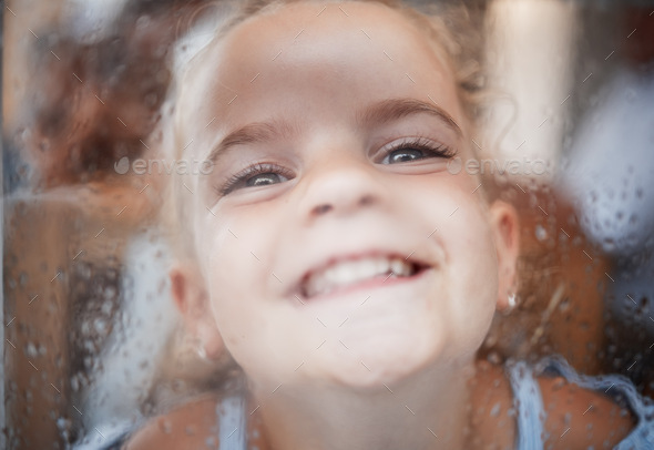Happy funny girl, face on window with flat nose on rainy glass and ...