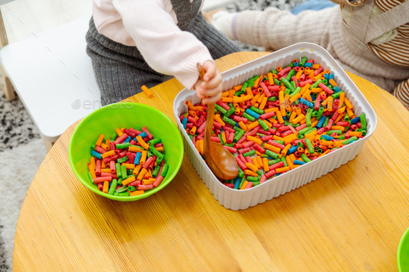 Sensory game sorting colored pasta Stock Photo by collab_media | PhotoDune